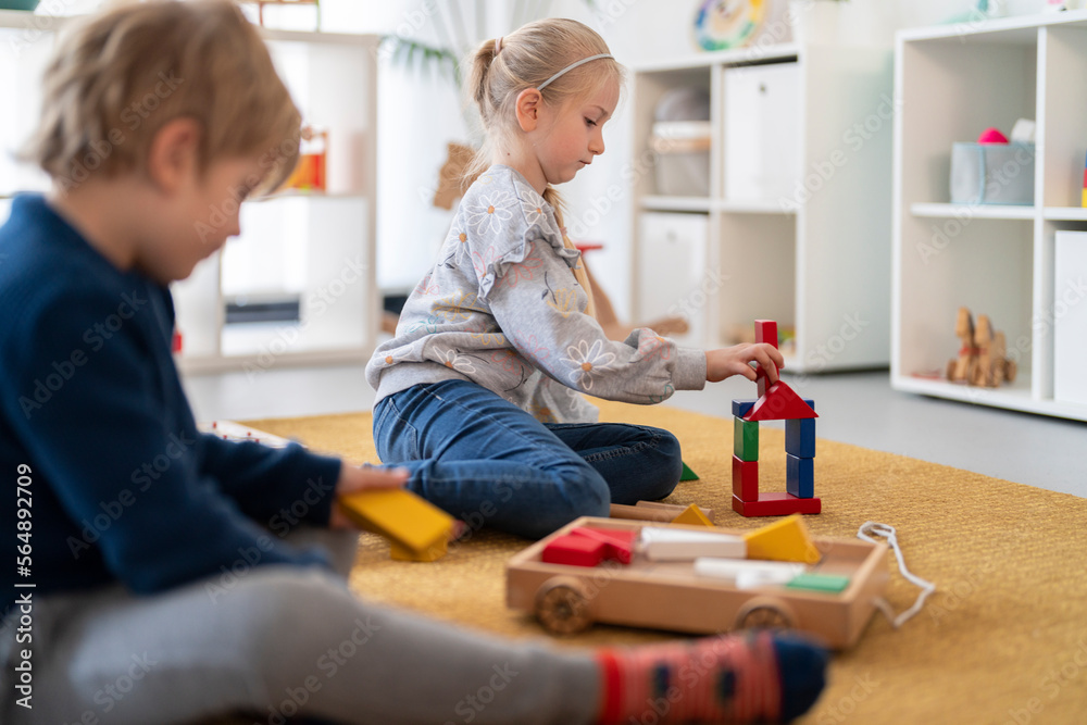 kids playing on a carpet in school Stock Photo | Adobe Stock