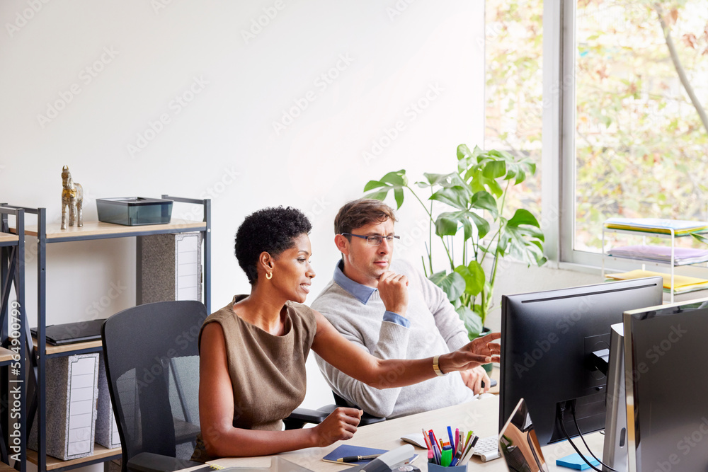 Black female manager explaining project to colleague Stock Photo ...