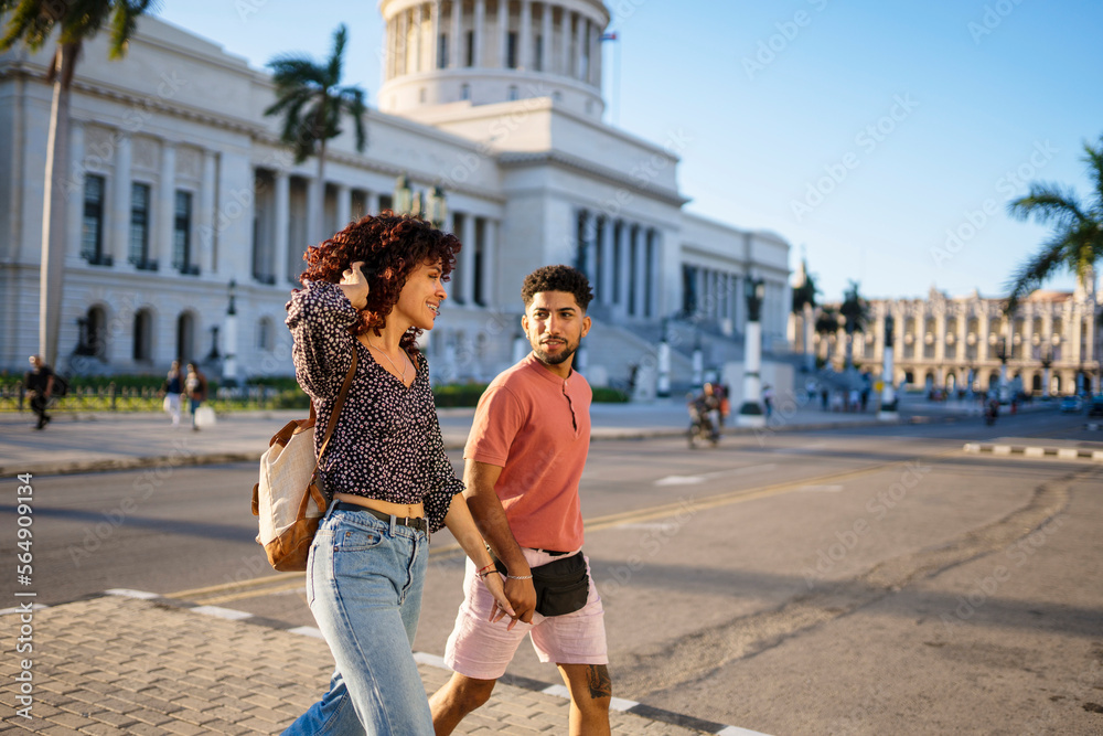 Cuban couple talking and crossing road Stock Photo | Adobe Stock