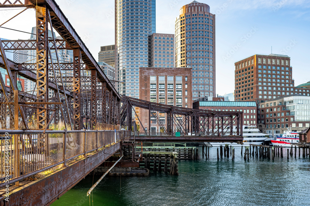 Rusty abandoned truss bridge and skyscrapers of down town in the bay on ...
