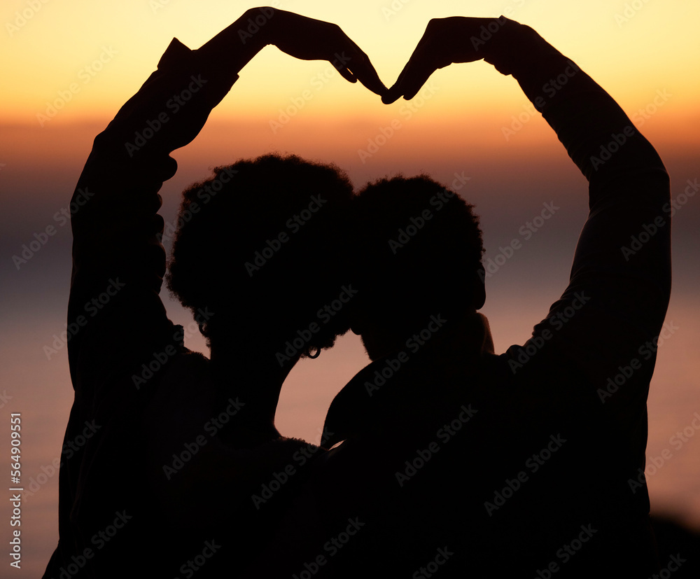 Sunset, heart and silhouette of couple at beach enjoying romantic ...