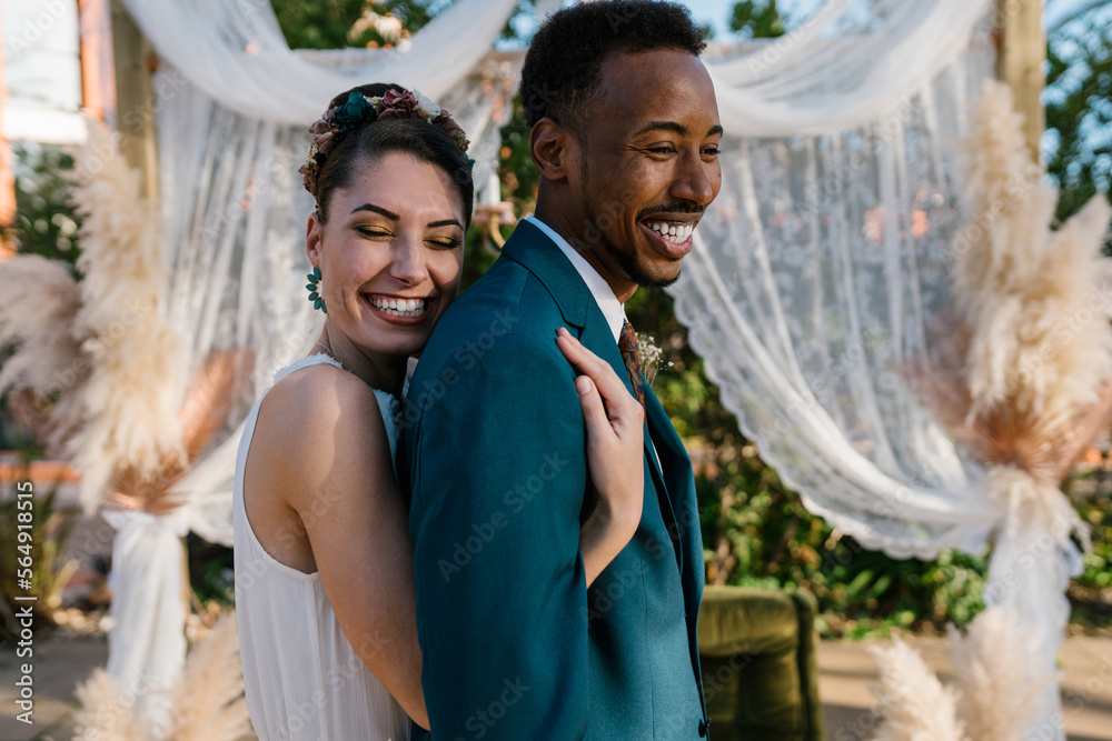 Happy diverse couple against wedding canopy Stock Photo | Adobe Stock