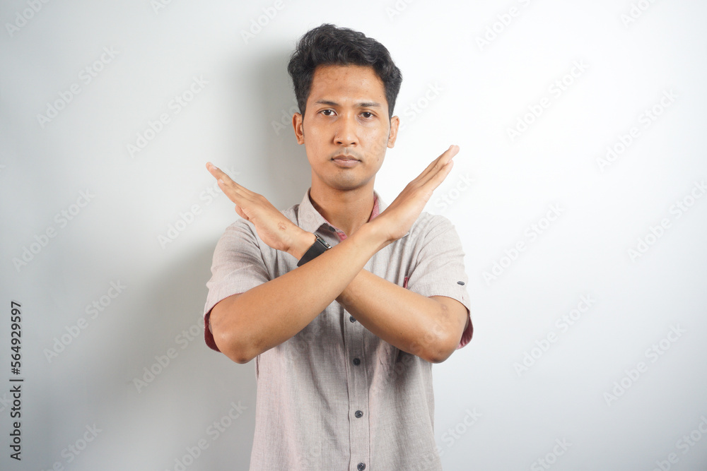 Serious asian millennial guy in casual saying no, looking at camera and ...