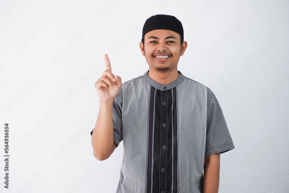 young asian muslim man finger pointing up raising a finger got a good ...