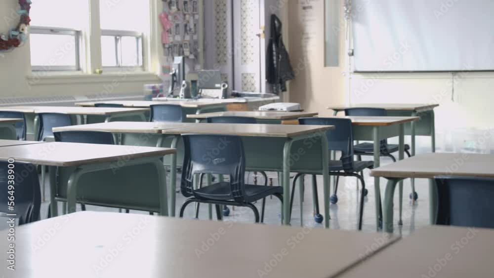 Establishing shot of empty classroom in school with desks Stock Video ...