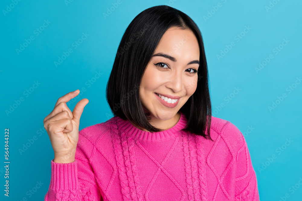 Portrait of cheerful filipino person arm fingers demonstrate small size ...