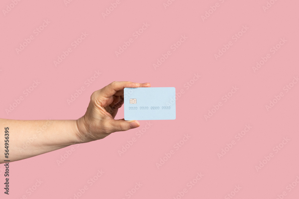 Hand holding credit / debit card Stock Photo | Adobe Stock