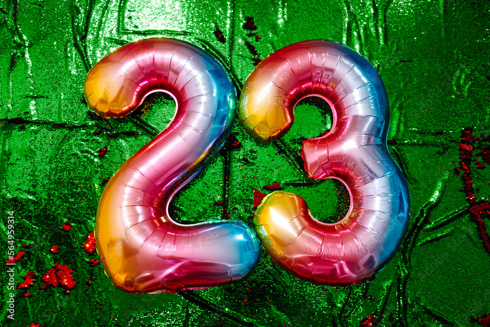 number 23 on a green sequin fabric Stock Photo | Adobe Stock