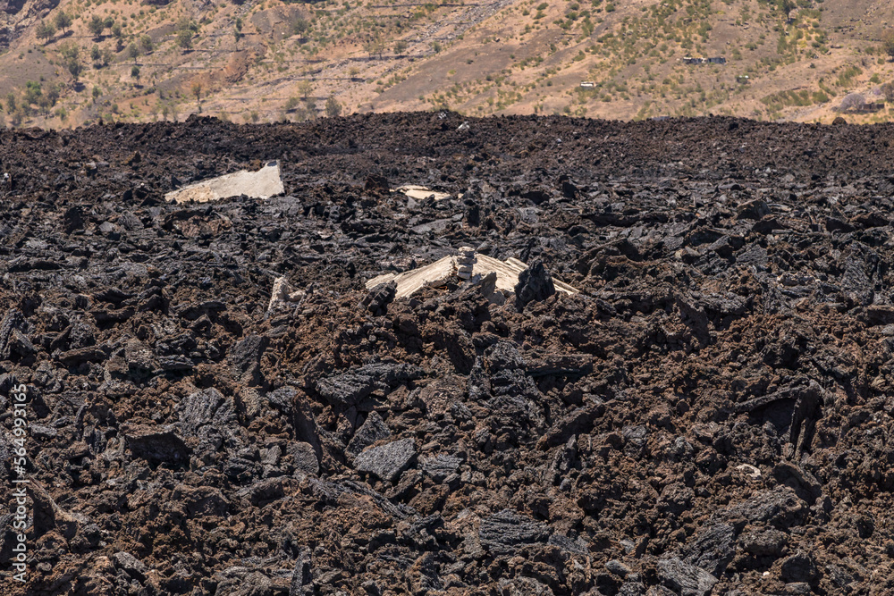 Houses in ruins destroyed by lava in the crater of the volcano Pico do ...