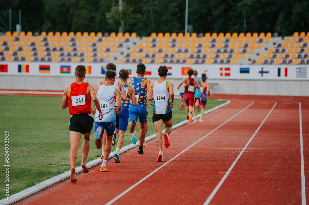 Energetic image of male athletes pushing their limits in middle ...