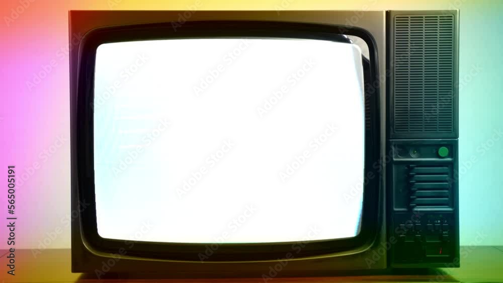 Vintage TV on colourful lights background, blinking screen and ...