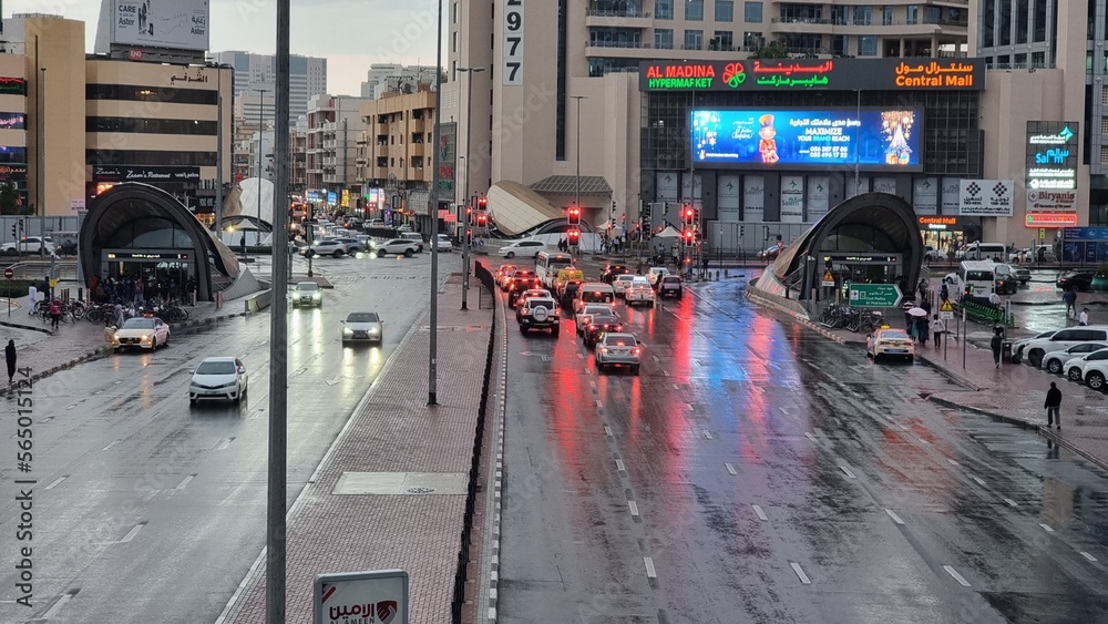 Cars driving through the flooded streets in Dubai during rain. Heavy ...