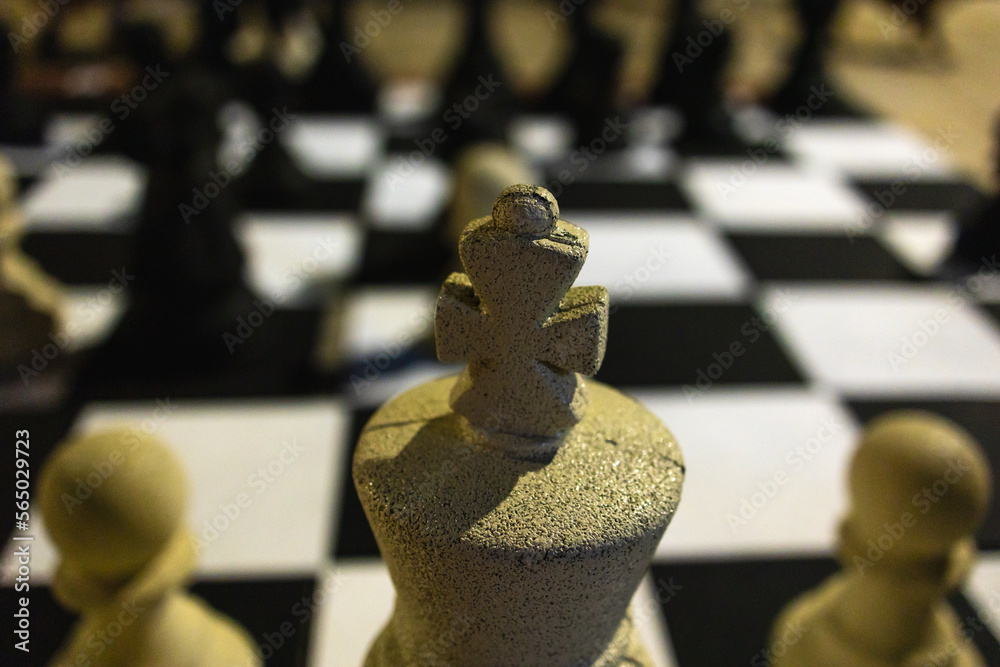The cross on the top of the chess piece is a close-up of the king ...