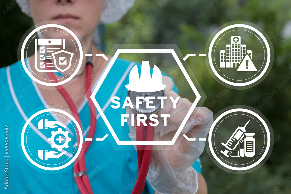 Doctor using virtual touchscreen presses inscription with icon: SAFETY ...