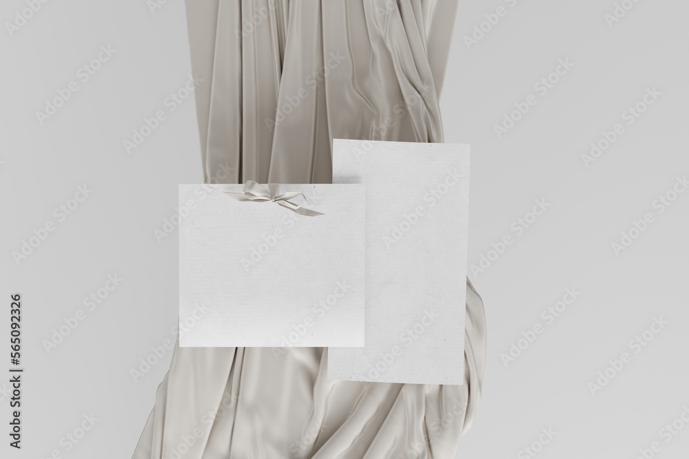 Two blank sheets of paper on background with beige satin material, with ...