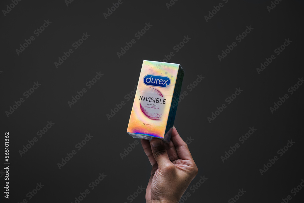 PENANG, MALAYSIA - MAR 24, 2020: One hand holding a box of Durex condom ...