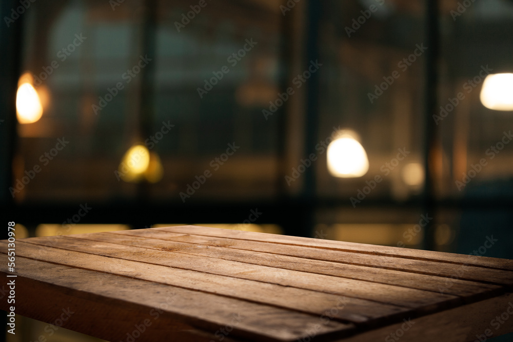 Empty dark wooden table in front of restaurant abstract blurred bokeh ...