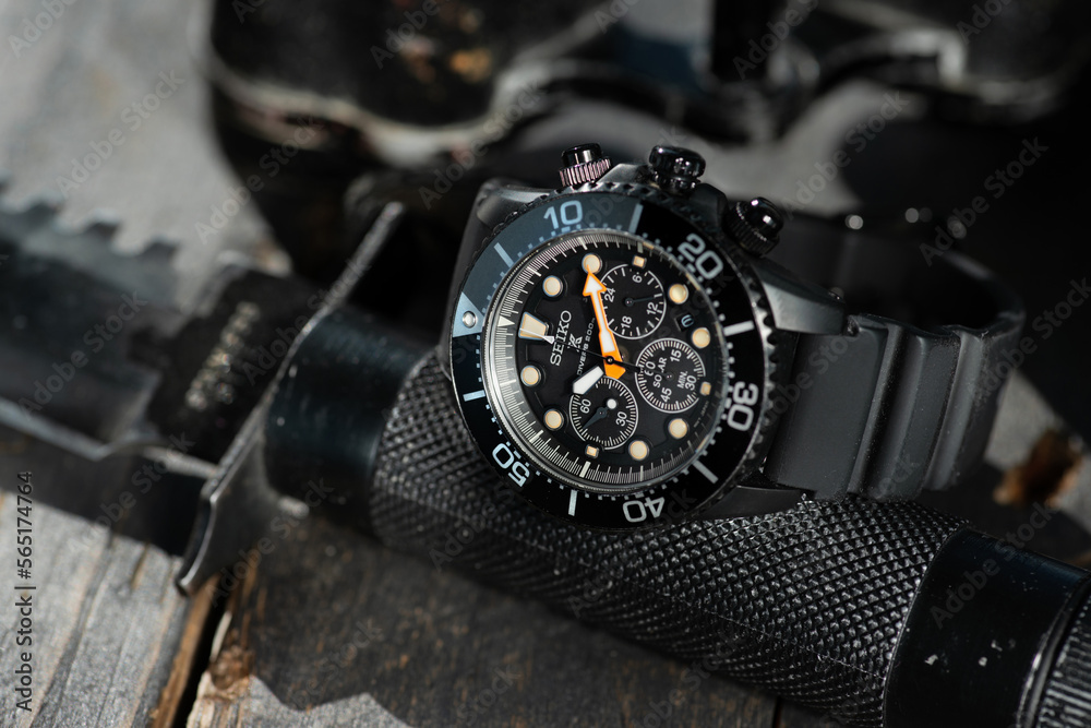 SEIKO Prospex black diver watch and knife no wooden table. Black ...
