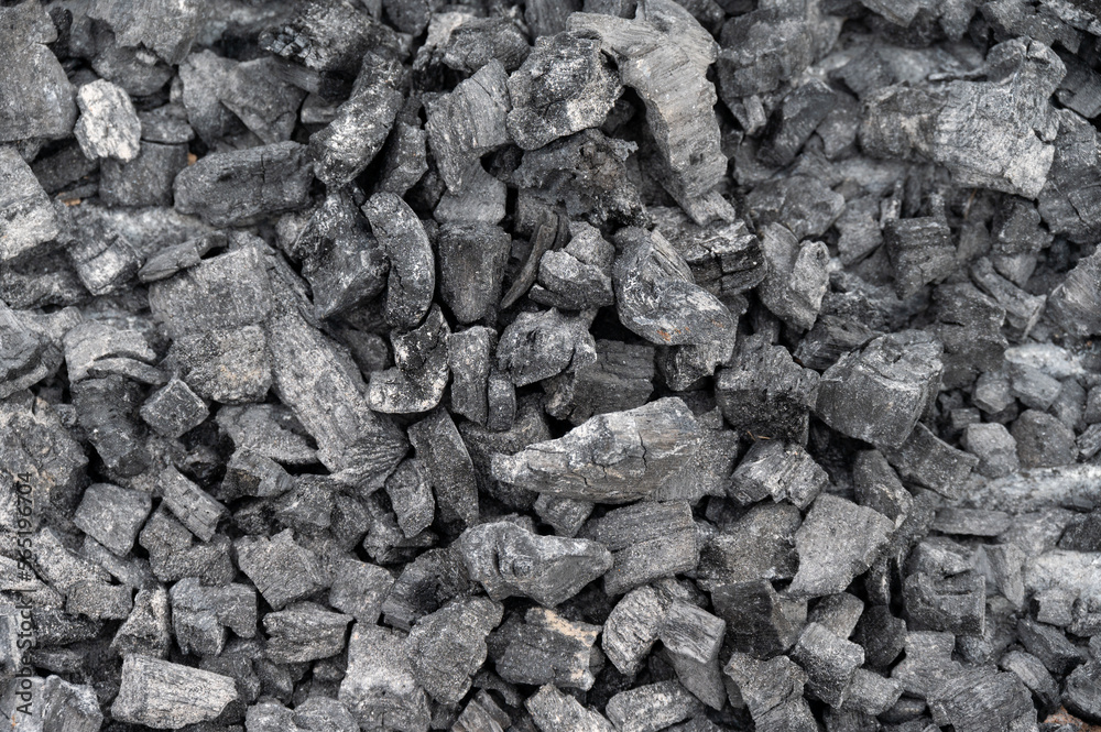 Full frame shot of the black coals. Coal is a fossil fuel, formed from ...