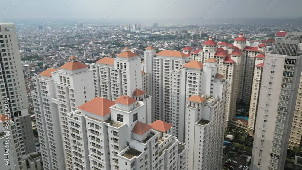 Sky view of high rise apartment buildings in the middle of packed and ...