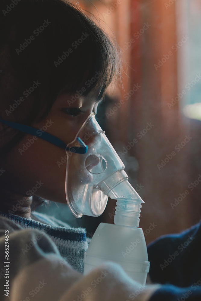 Little girl making inhalation with nebulizer at home. child asthma ...