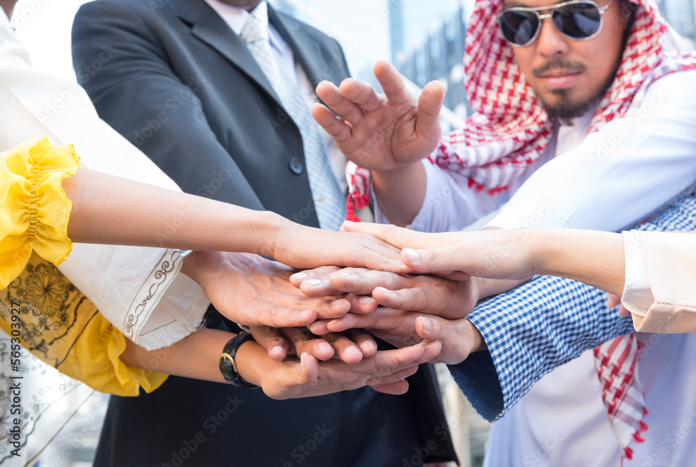 Persian and Arab business people join hands oneness. Unity and teamwork ...