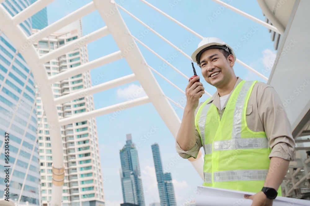 Engineers using walkie-talkie in construction site. civil engineer walk ...