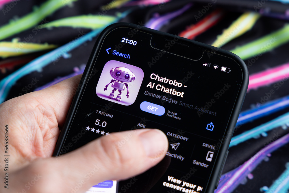 Woman's hand holding an iPhone with appstore and ChatGPT and Chat bot ...