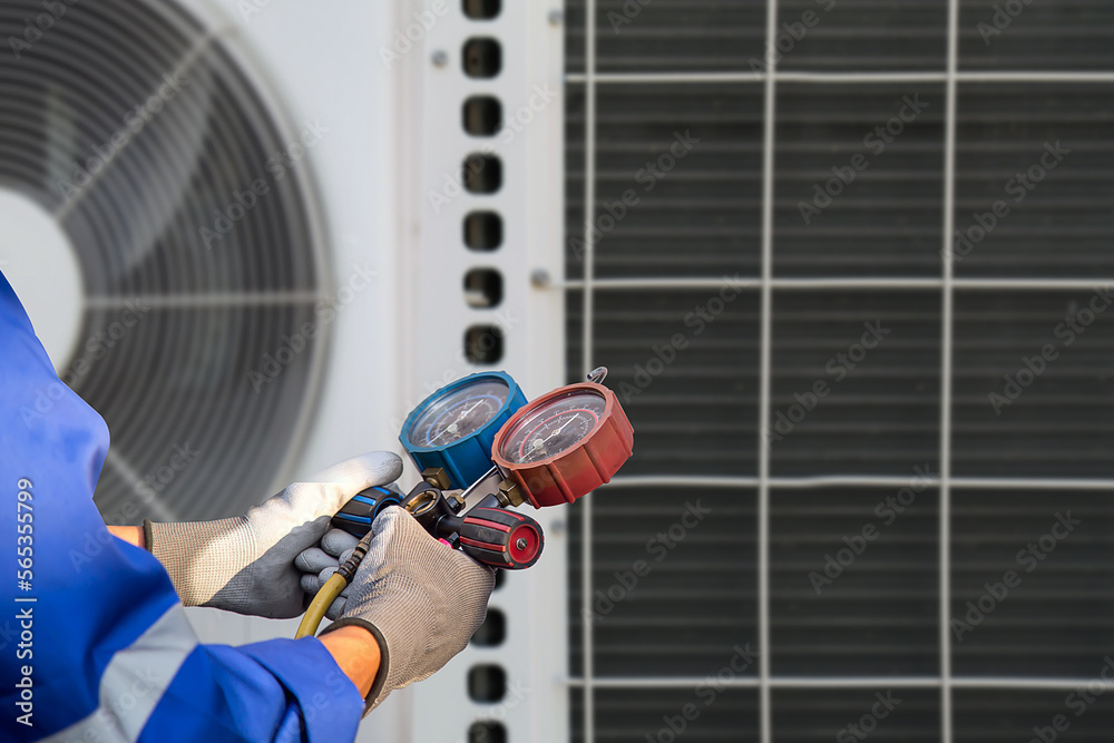 Heat and Air Conditioning, HVAC system service technician using ...