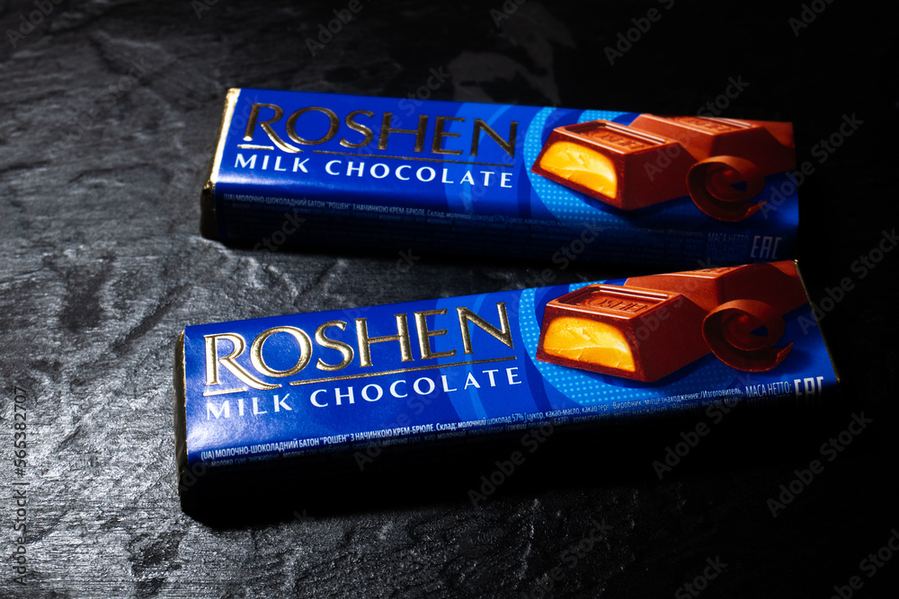 LVIV, UKRAINE - January 25, 2023 : Roshen Milk chocolate bar on black ...