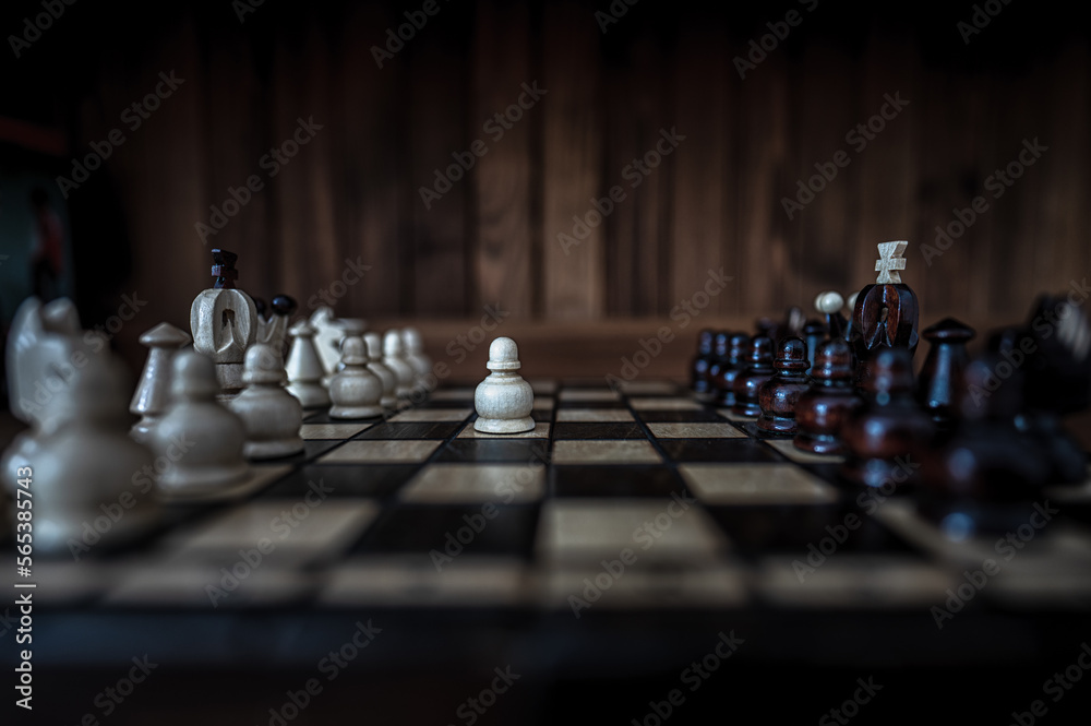 Blurred background with a low depth of focus. The set of wooden chess ...