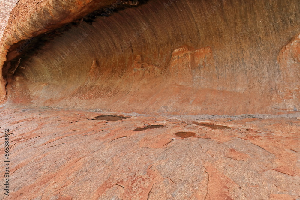 Kitchen Cave on the wall of Uluru-Ayers Rock seen from the base walk ...