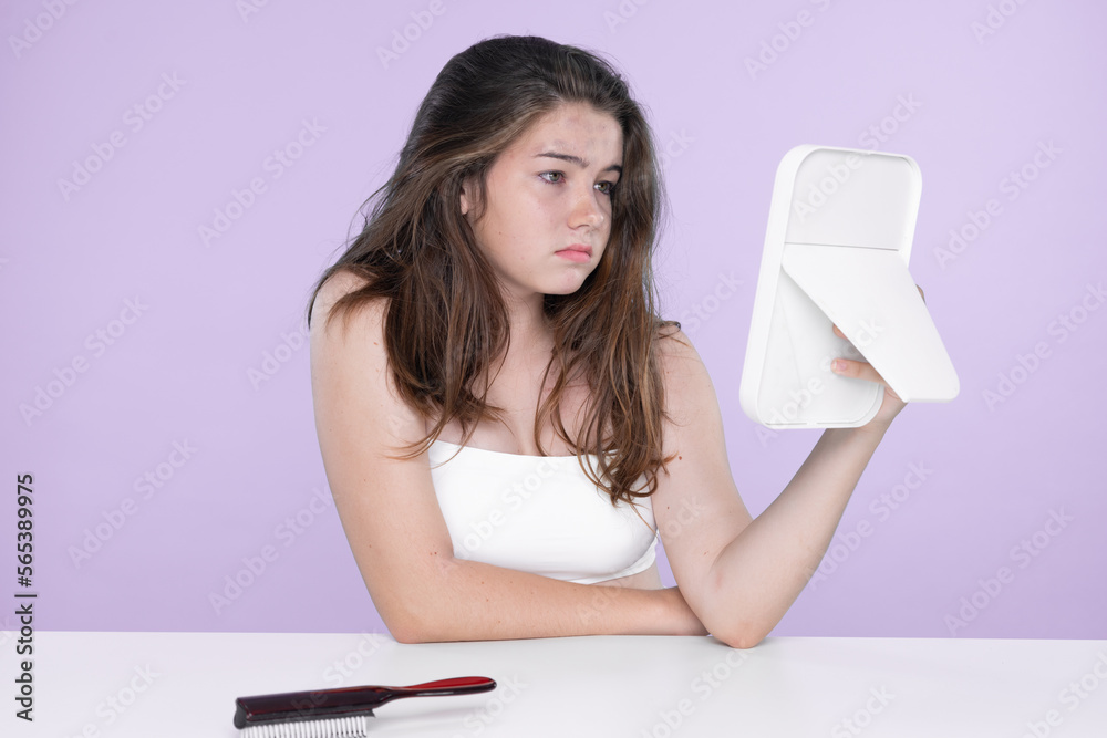 Beautiful girl feel sad, worry about her damaged hair with isolated ...