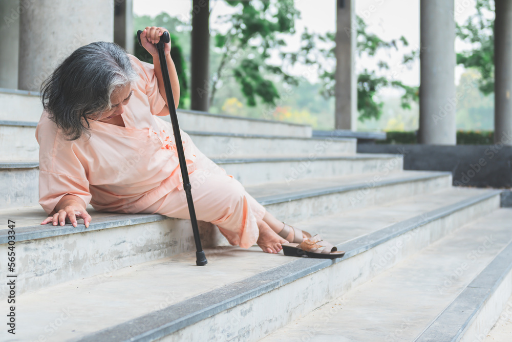 Asian elderly woman patient slipping, falling while walking down the ...