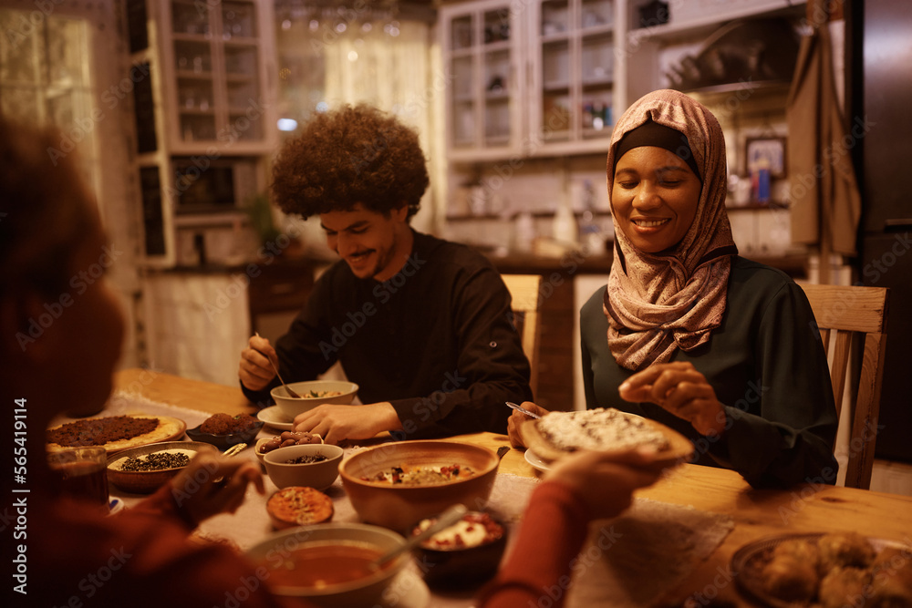Happy Middle Eastern family enjoying in dinner at dining table. Stock ...