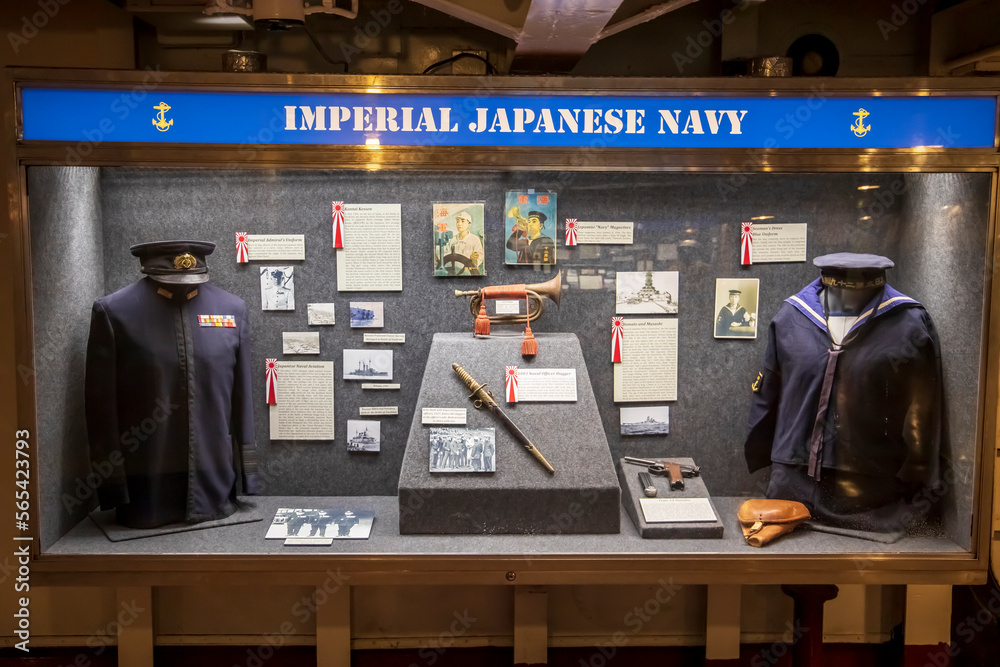 Inside the first deck of the USS Alabama Battleship with display cases ...