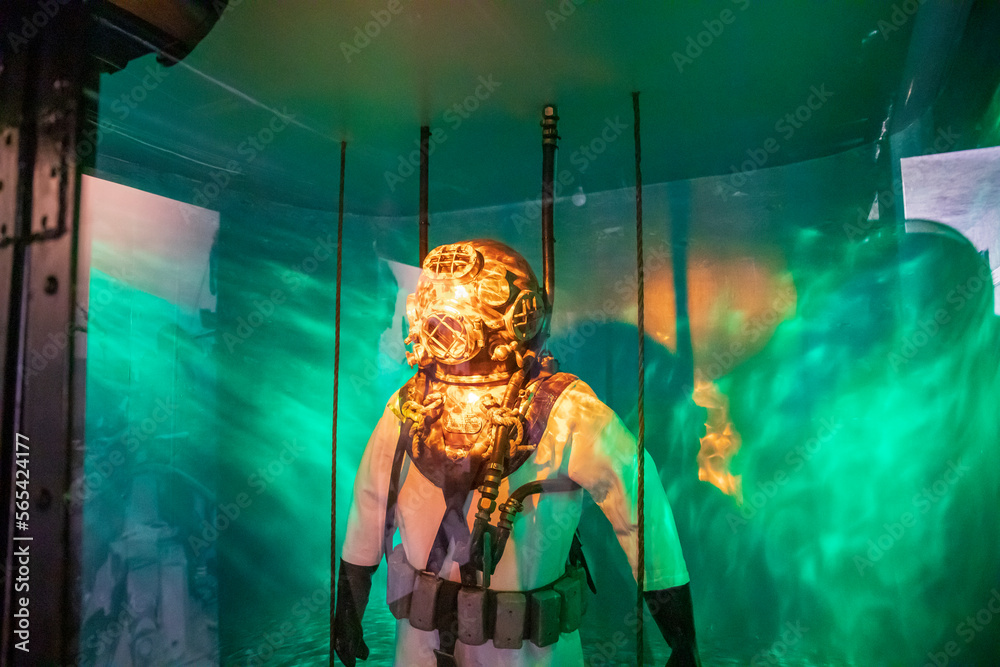 Inside Of The Uss Alabama Battleship With Glass Case Filled With A Underwater Diving Suit And A