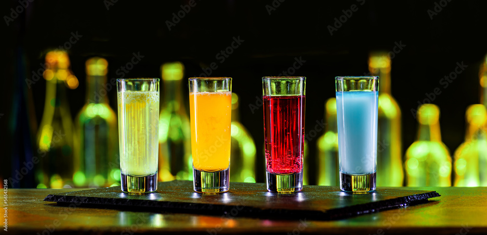 Cocktails Party Shots and Shooters on bar counter in a restaurant, pub ...