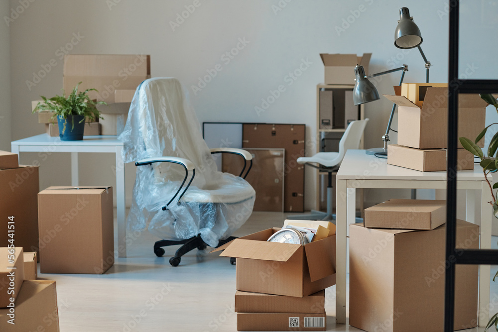 Horizontal image of big light office with new furniture and unpacked ...