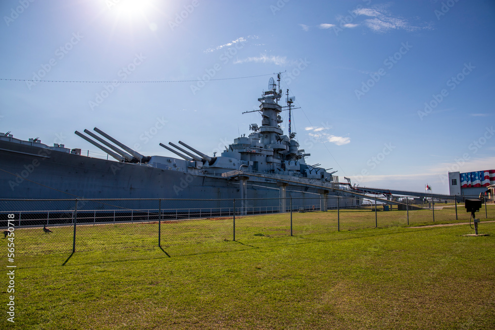 The USS Alabama Battleship docked in Mobile Bay surrounded by lush ...