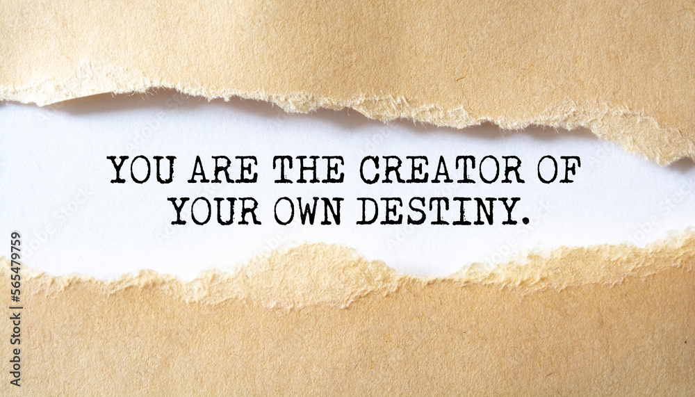 You Are the creator of your own destiny. Words written under torn paper ...