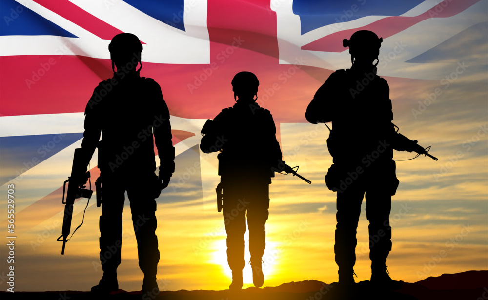 Silhouettes of soldiers with United Kingdom flag on background of sky ...