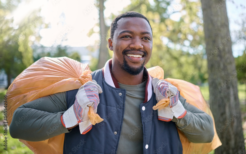 Volunteer, community service and black man cleaning park with garbage ...