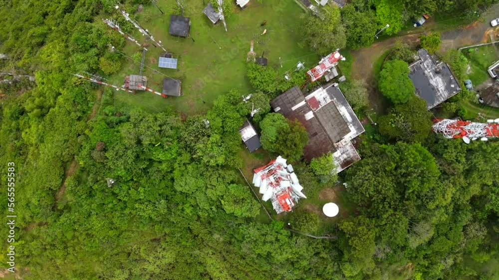 Aerial shot drone flies with camera straight down over top three ...