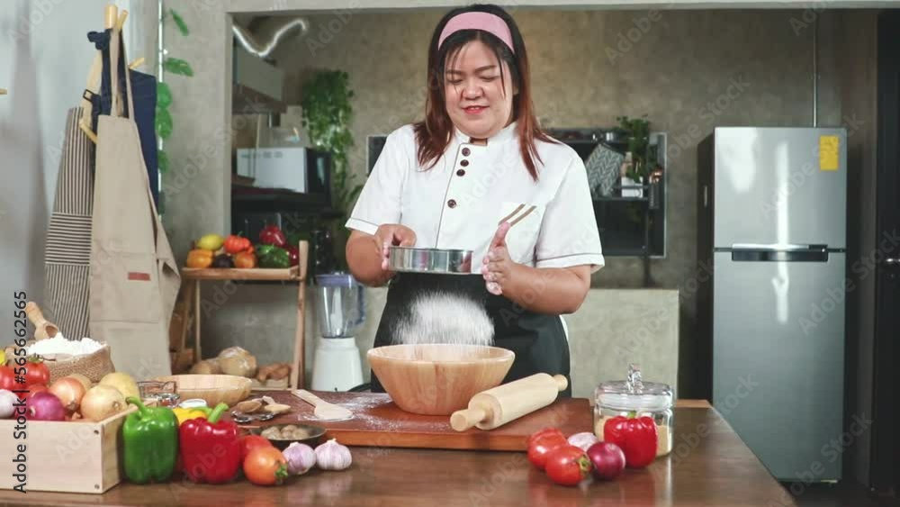 Fat asian female chef making home-made pizza at home, traditional ...