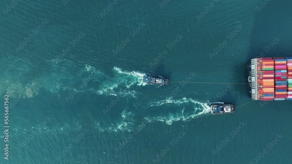 Tugboat drag Largo Cargo Container Ship. Stern of Container Ship with ...