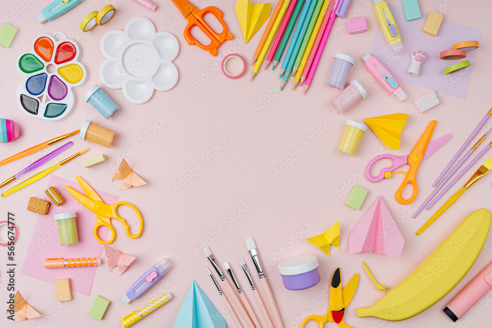 Pink pastel background with various colorful material for creativity ...