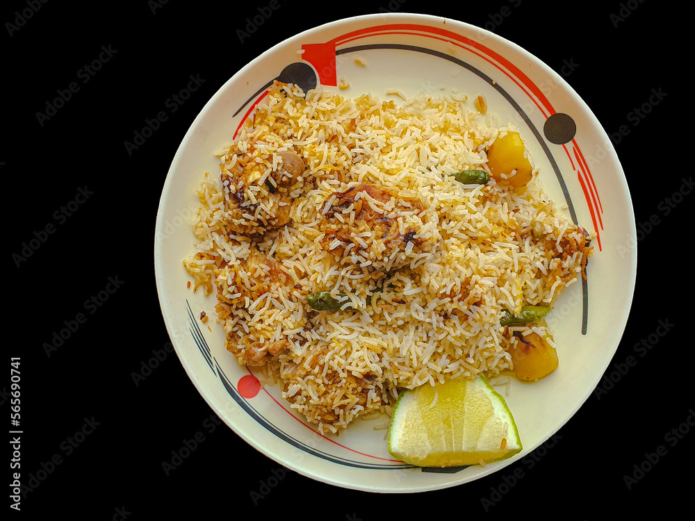 Traditional south Indian Basmati kacchi biryani with mutton and a lemon ...