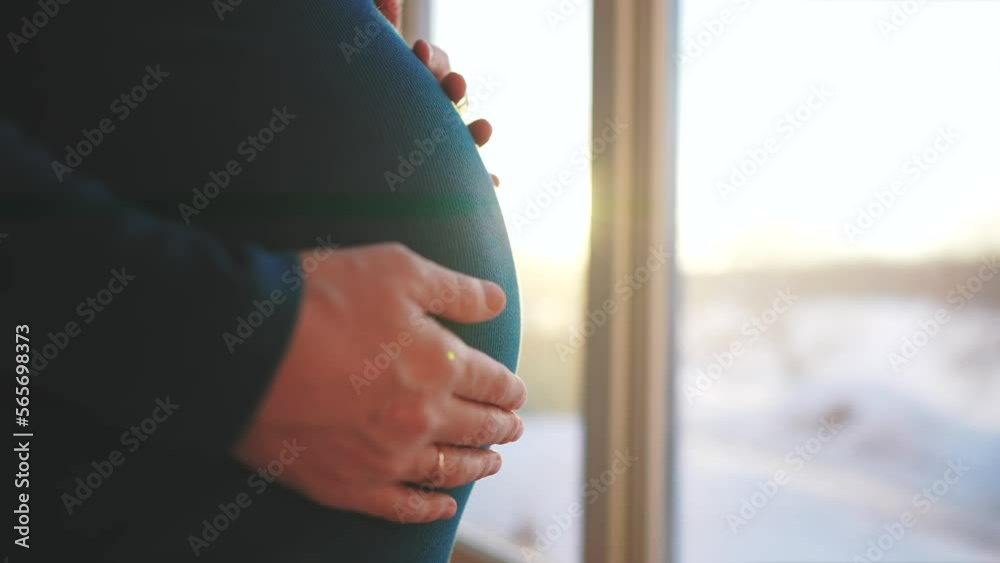 woman pregnant. motherhood a pregnancy concept sunset. 40 year old ...