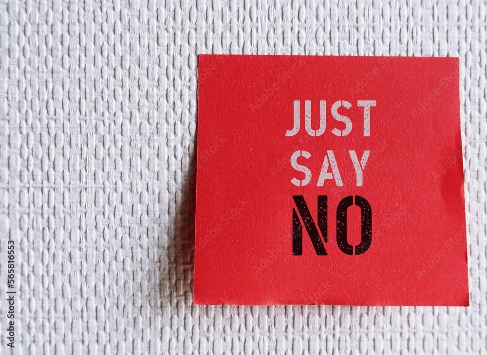 Red note on wallpaper background with text JUST SAY NO , learn to say ...